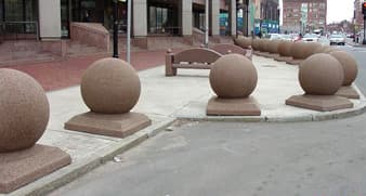 Concrete bollards protect entrances to buildings